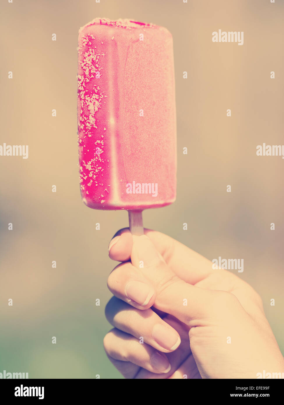 Pink ice cream with chocolate on stick hi-res stock photography and ...