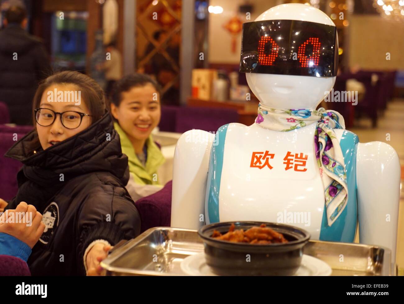 Nanchang, China's Jiangxi Province. 2nd Feb, 2015. People watch a robot ...