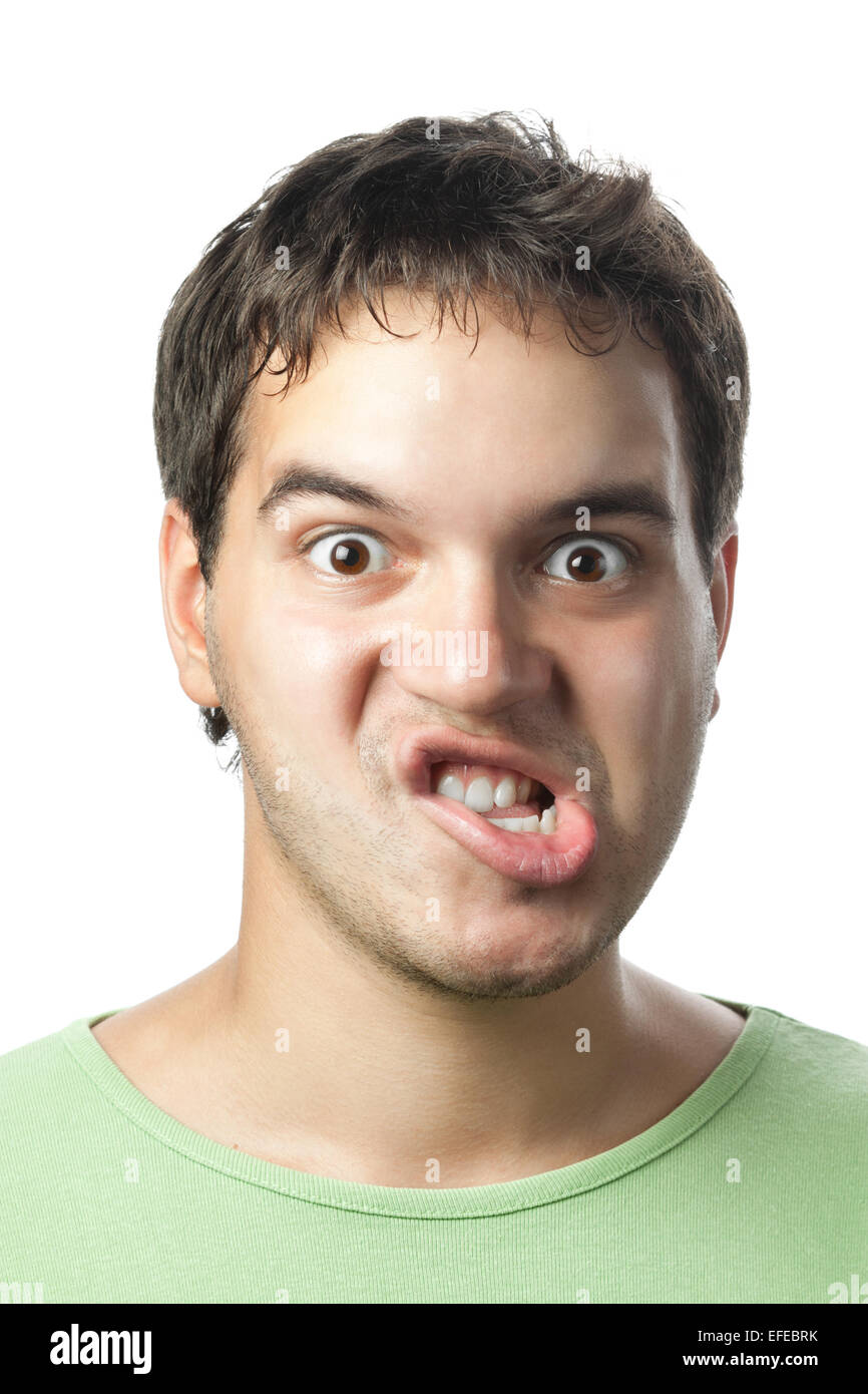 portrait of young grimacing man isolated on white background Stock ...