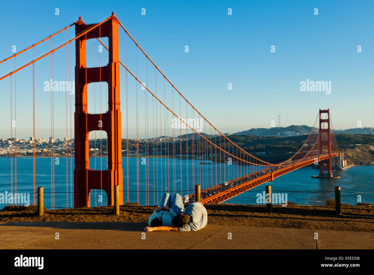 A couple on Battery Spencer overlooking the Golden Gate Bridge San ...