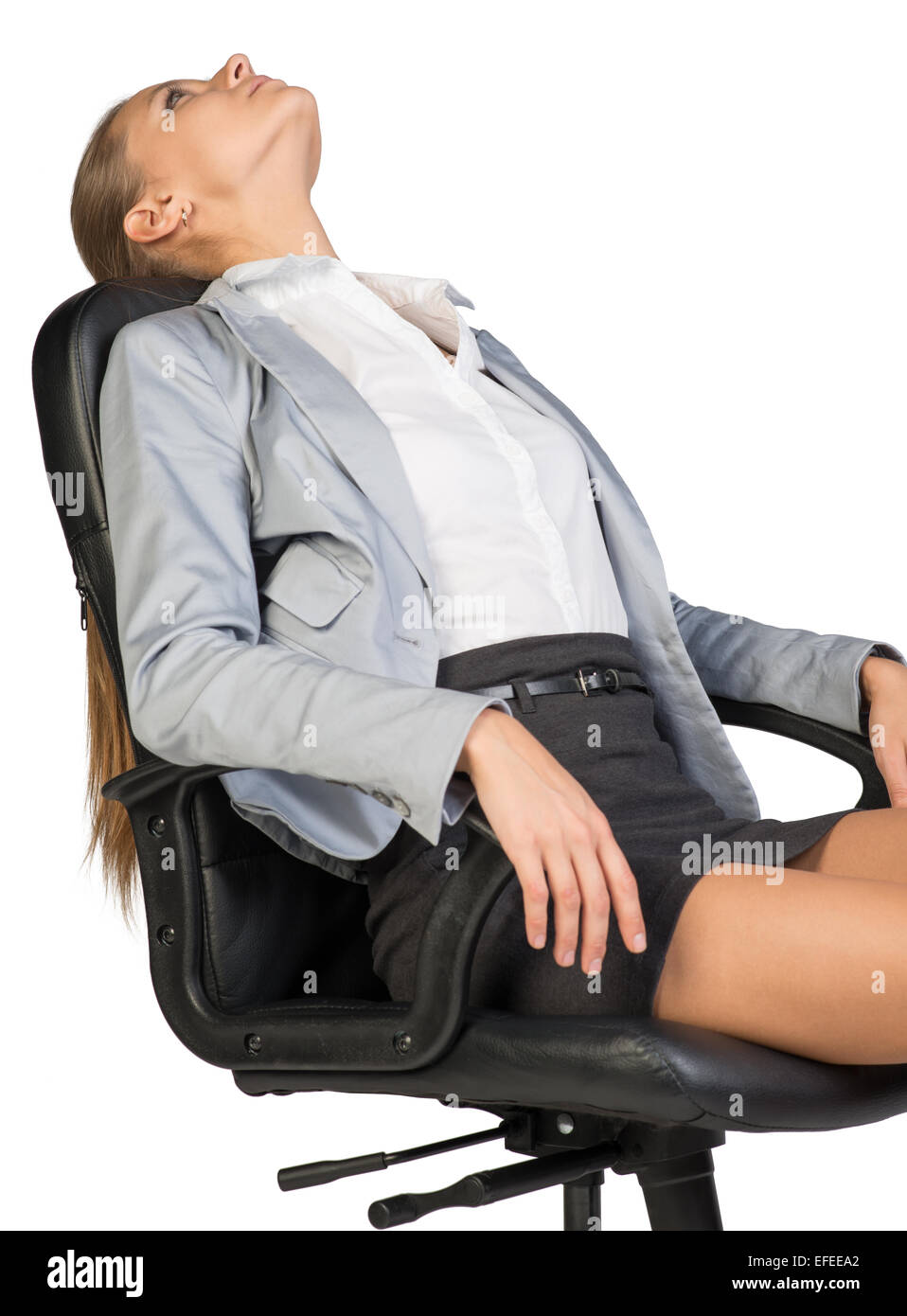 Businesswoman resting in office chair with her head thrown back Stock ...