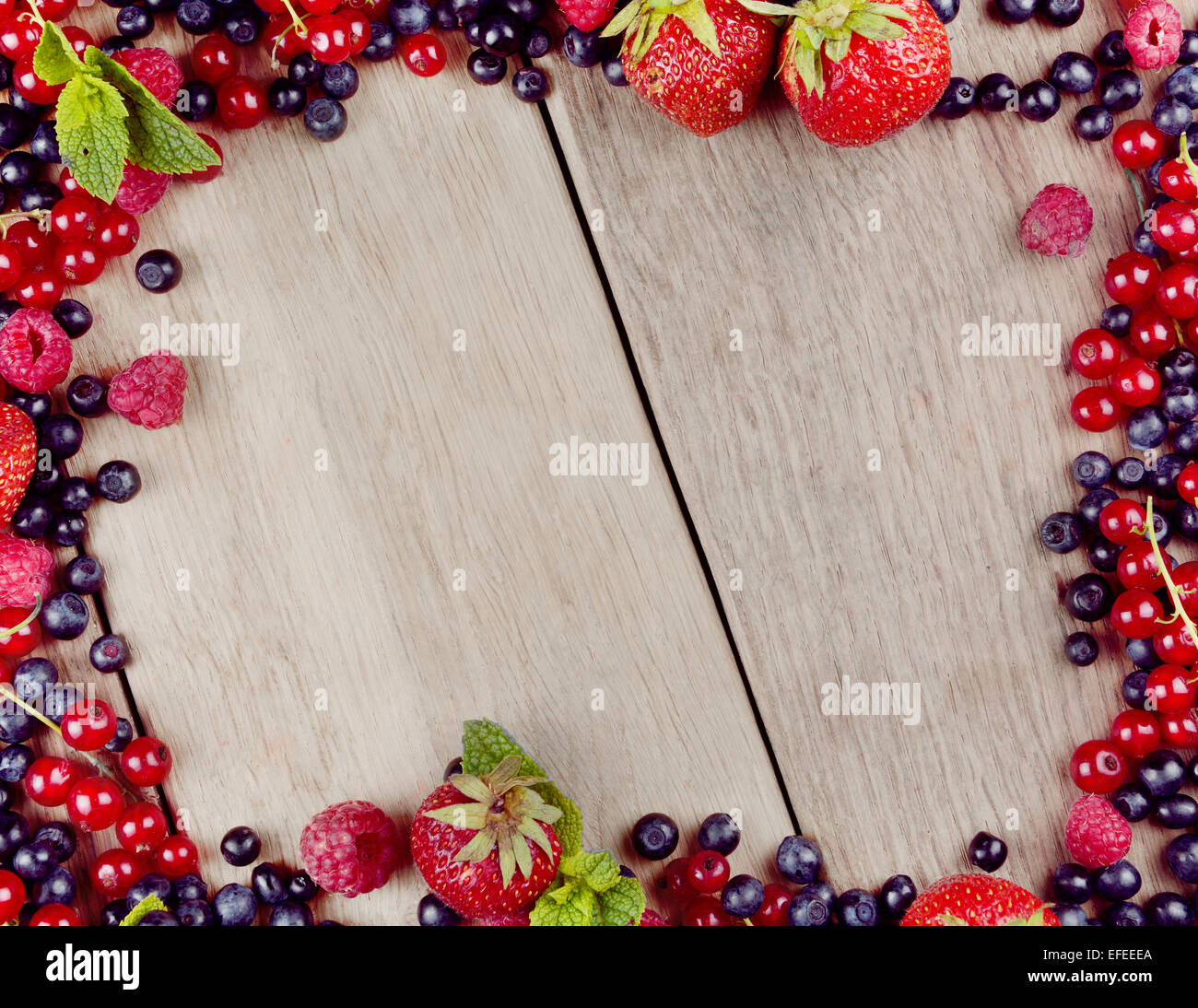 Bright summer frame of fresh sweet berries on the table Stock Photo - Alamy