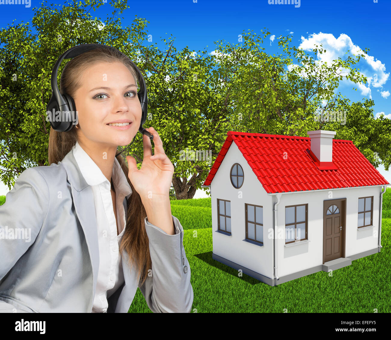 Businesswoman in headset, small house and green landscape as backdrop ...
