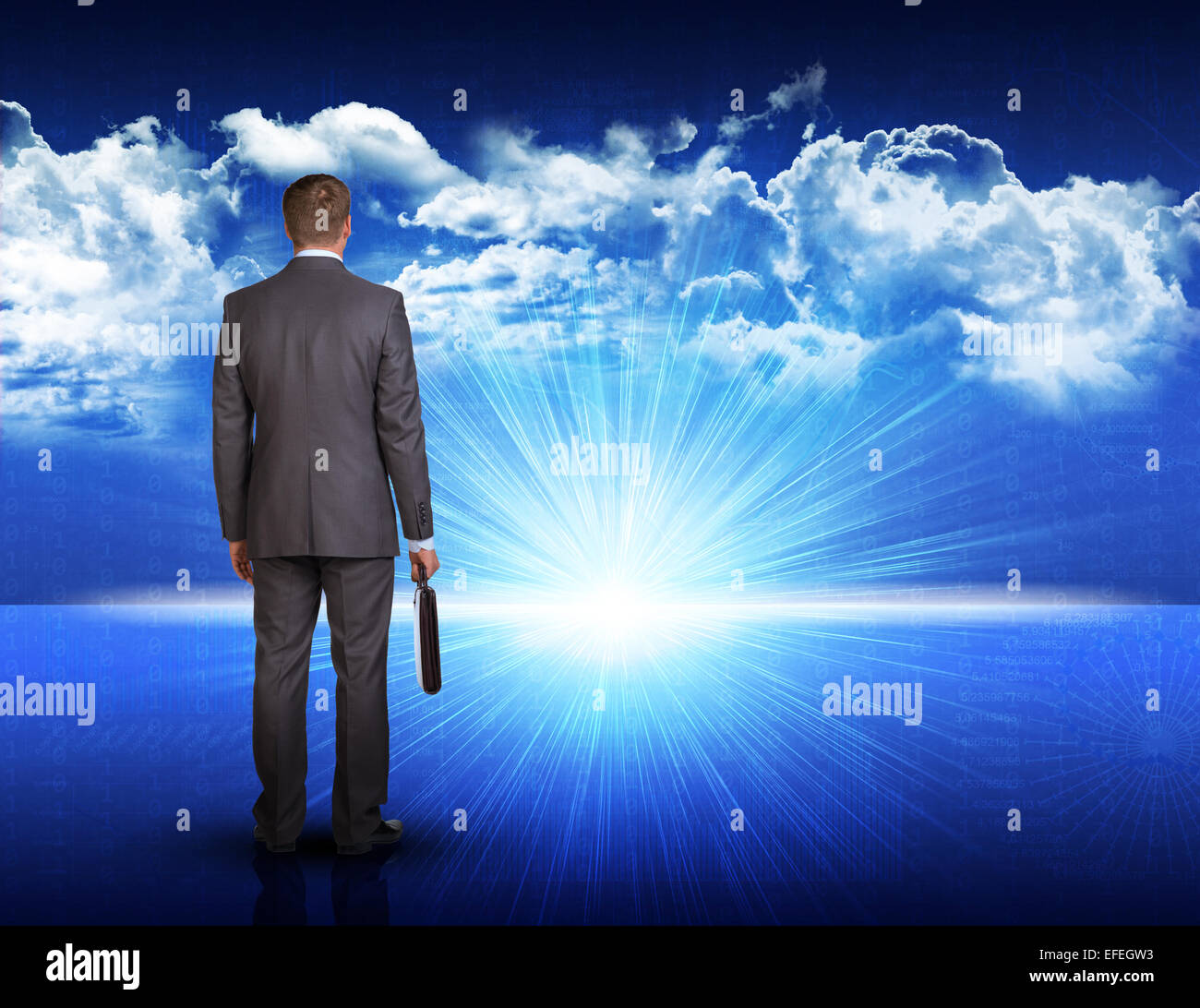 Businessman standing against blue landscape with rising sun Stock Photo ...