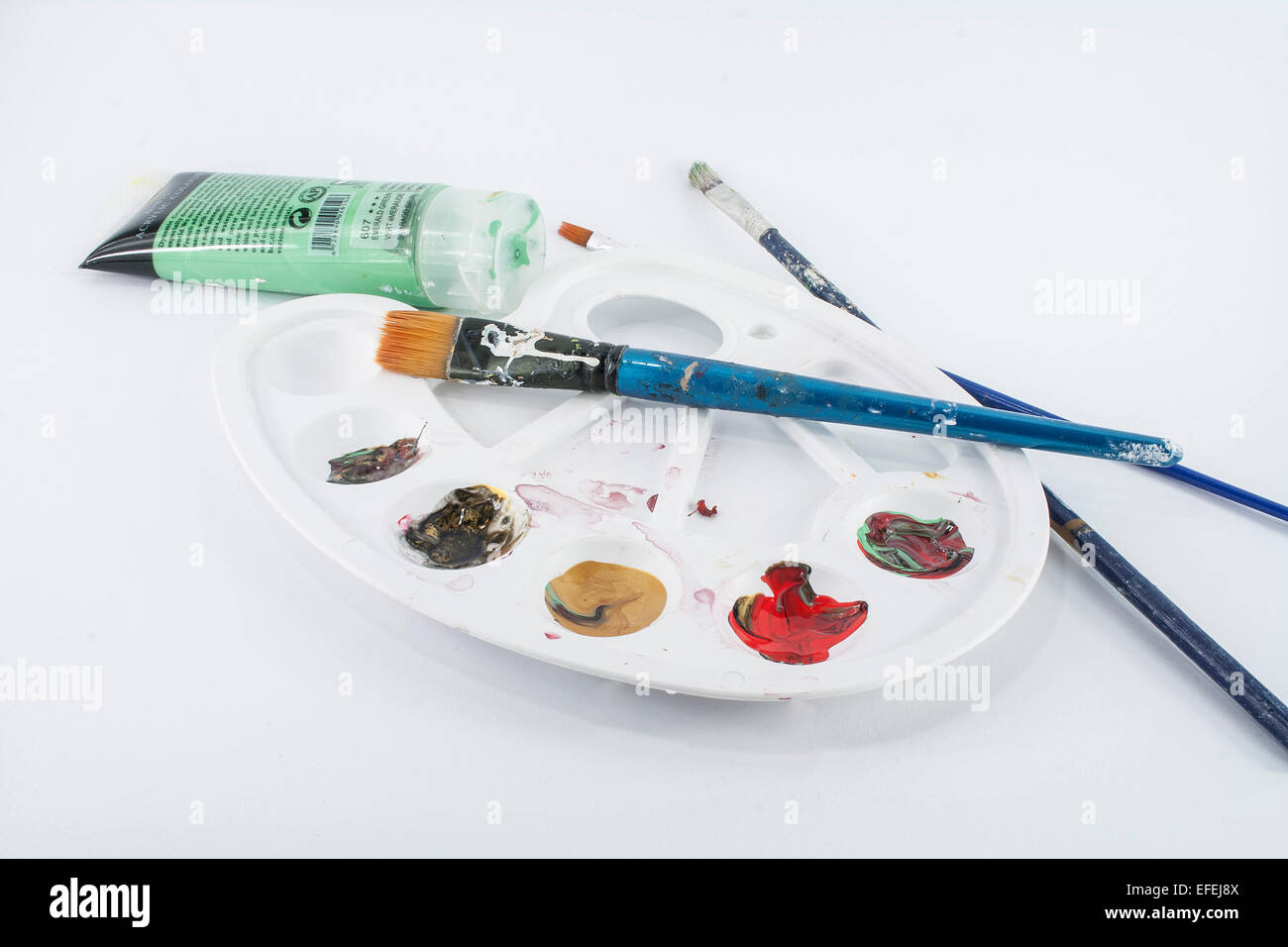 Beautiful paint palette with mixed colors Stock Photo - Alamy