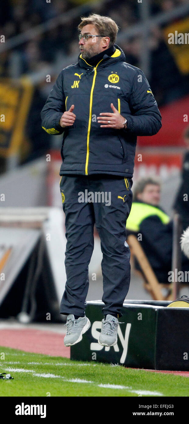 Dortmund's coach Juergen Klopp jumps as he stands on the sideline ...