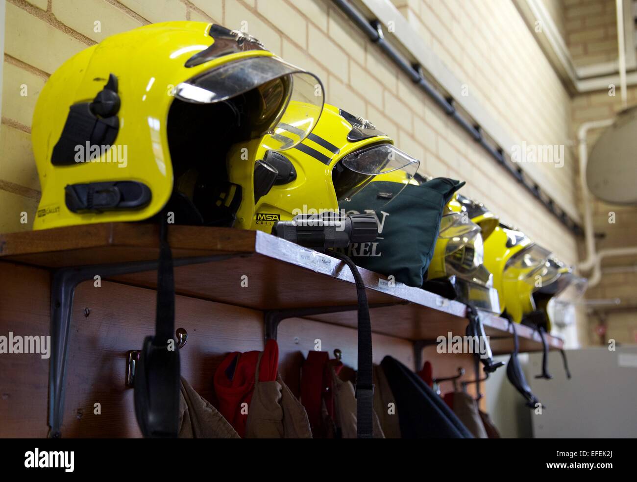 Row of Fifefighters helmets at a UK firestation Stock Photo - Alamy