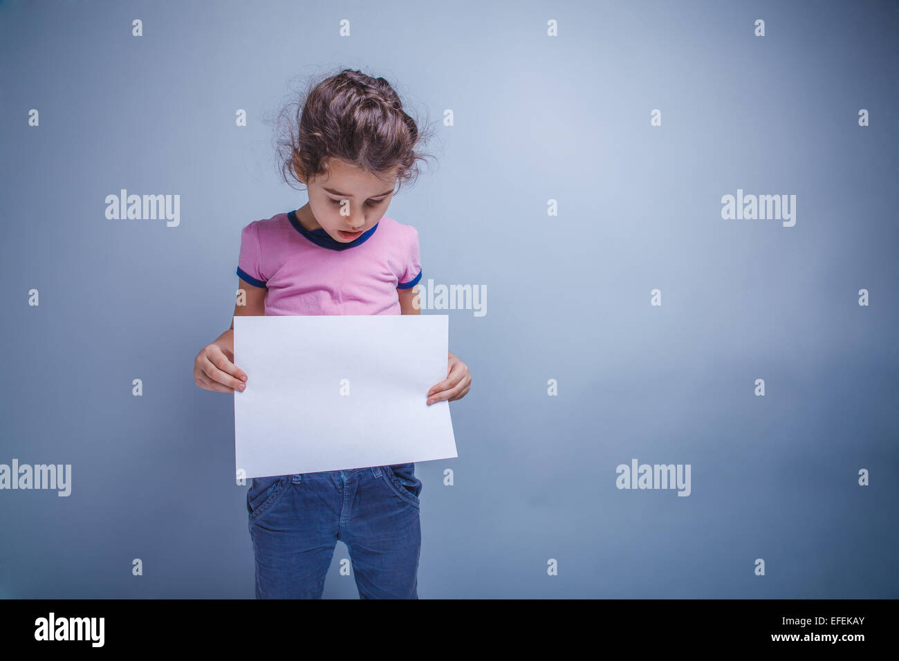 girl child 6 years of European appearance holds a blank slate, l Stock ...