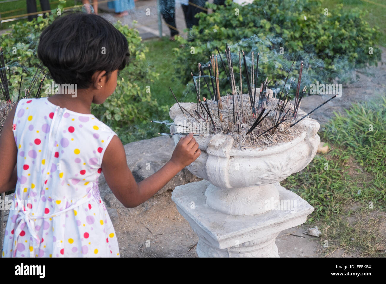 Incense offering by pilgrims devotees at Temple of the Sacred Tooth ...