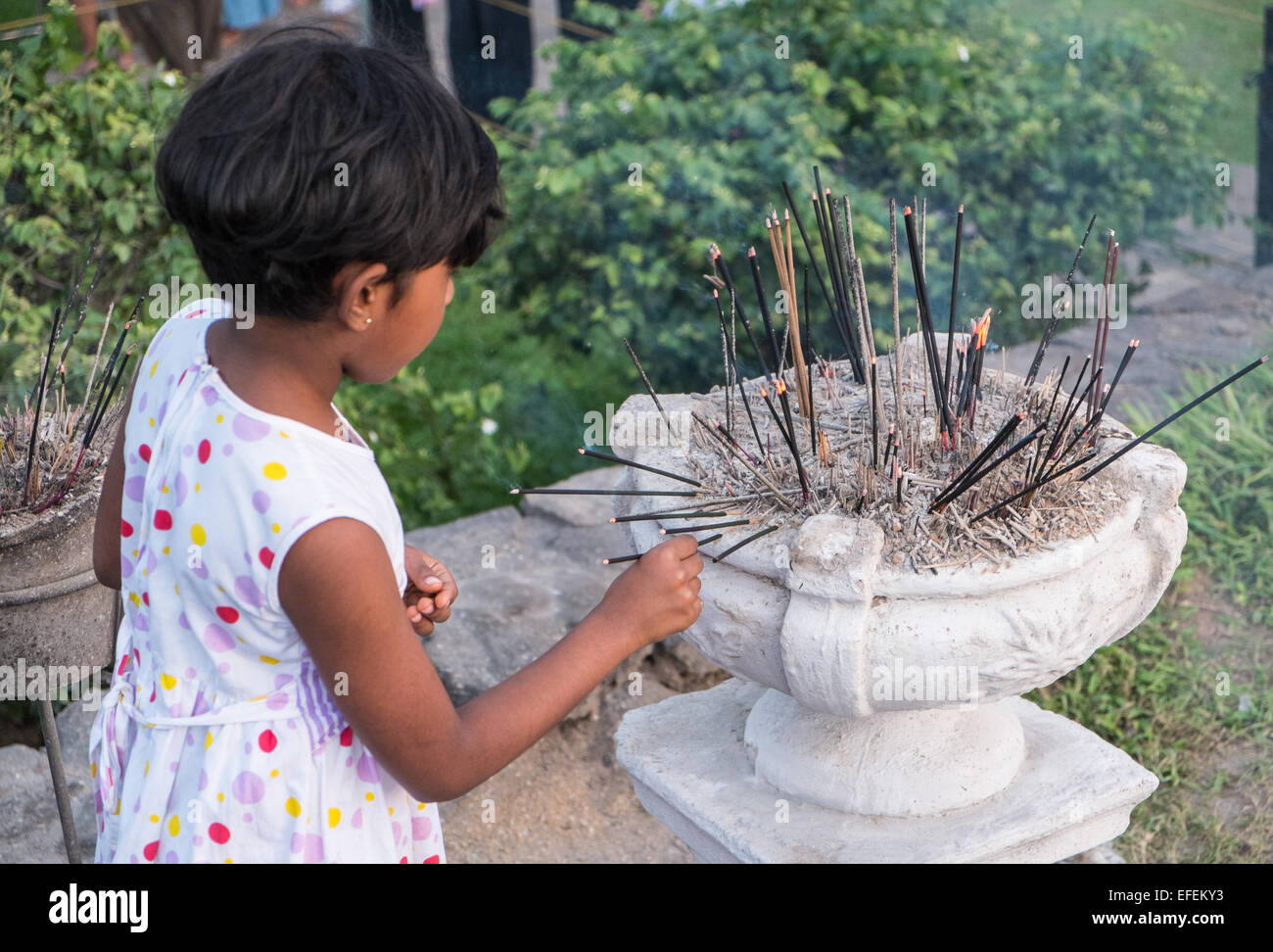 Incense offering by pilgrims devotees at Temple of the Sacred Tooth ...