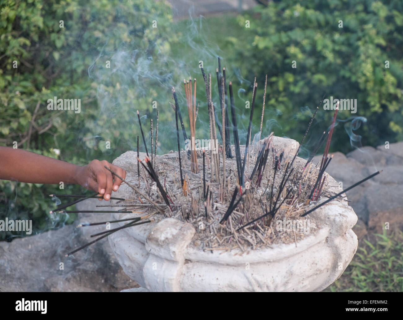 Incense offering by pilgrims devotees at Temple of the Sacred Tooth ...