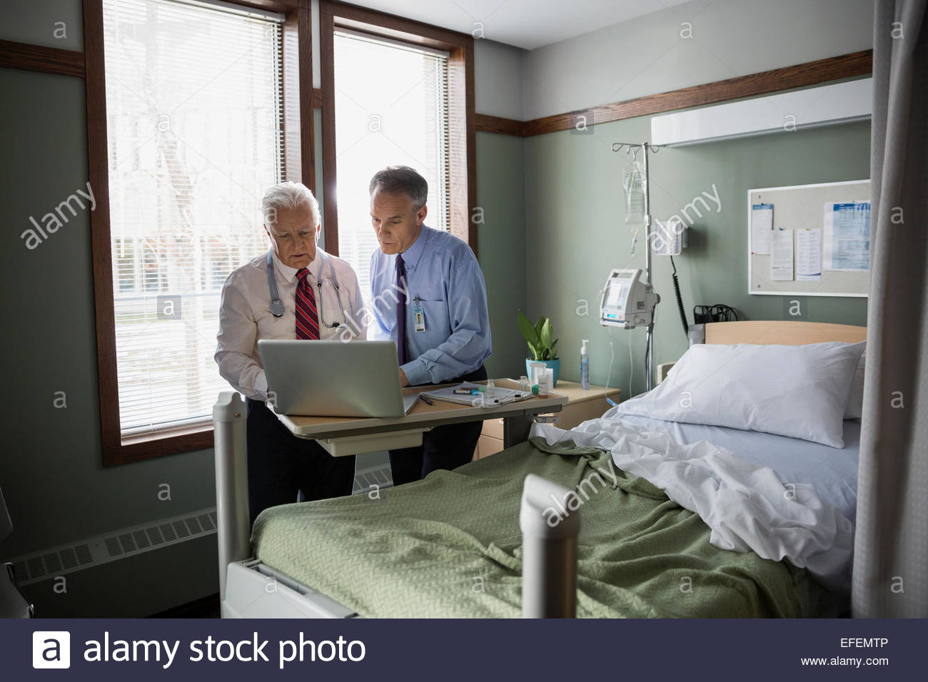 Using laptop in hospital hi-res stock photography and images - Alamy