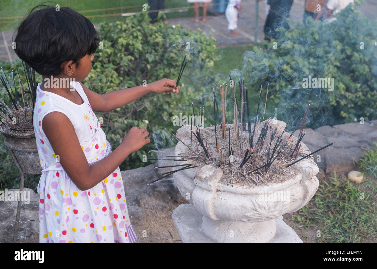 Incense offering by pilgrims devotees at Temple of the Sacred Tooth ...