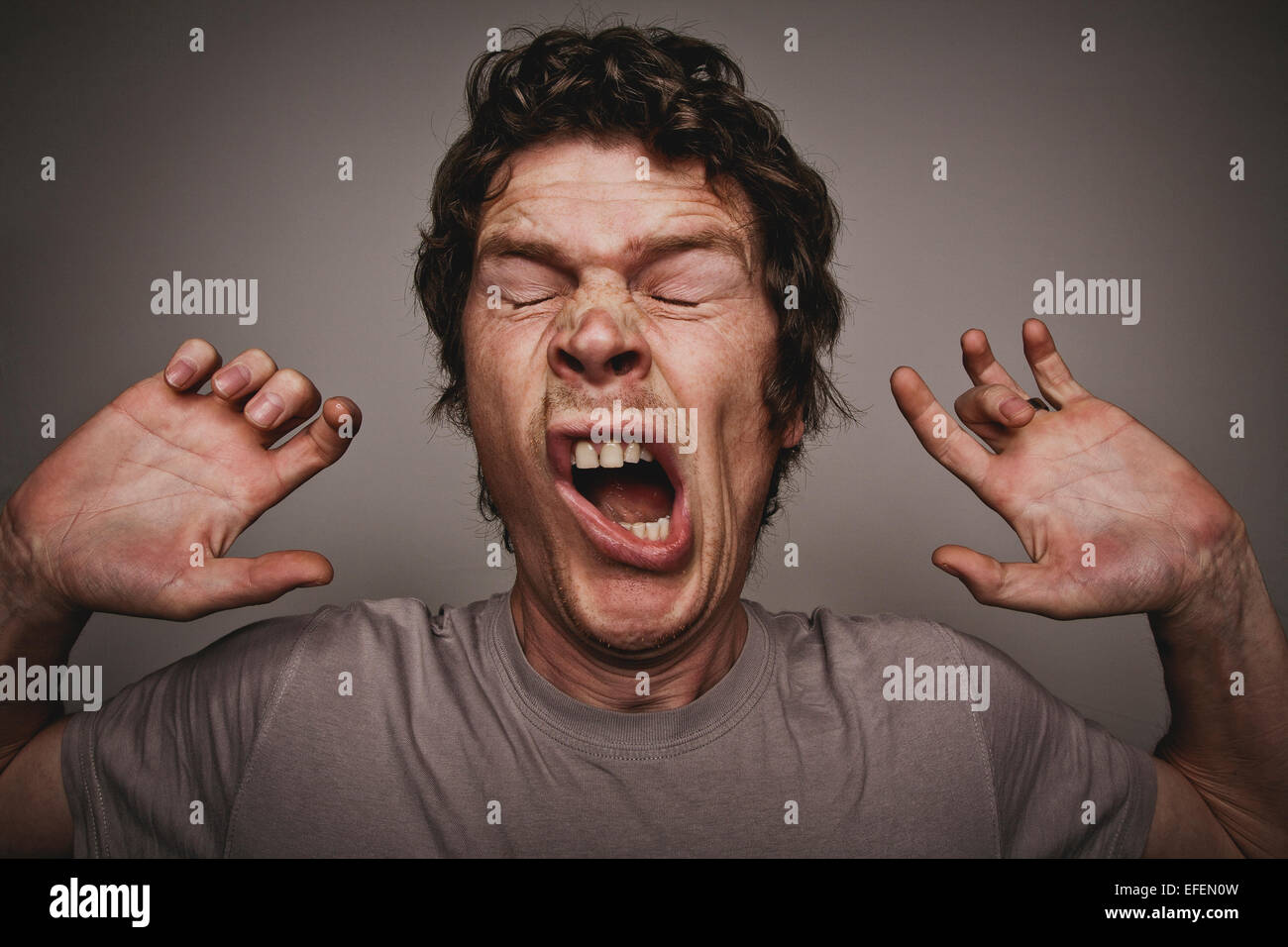 head and shoulders shot of a man yawning Stock Photo - Alamy