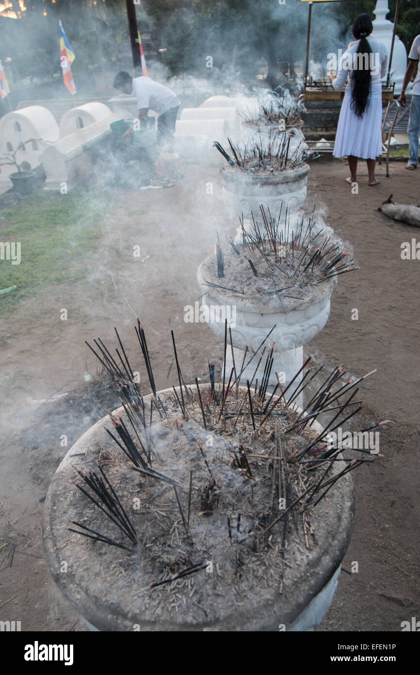 Incense offering by pilgrims devotees at Temple of the Sacred Tooth ...