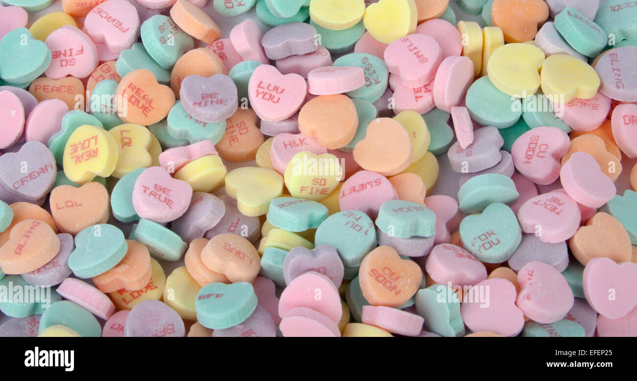 A bunch of colorful Valentine's candy hearts Stock Photo - Alamy