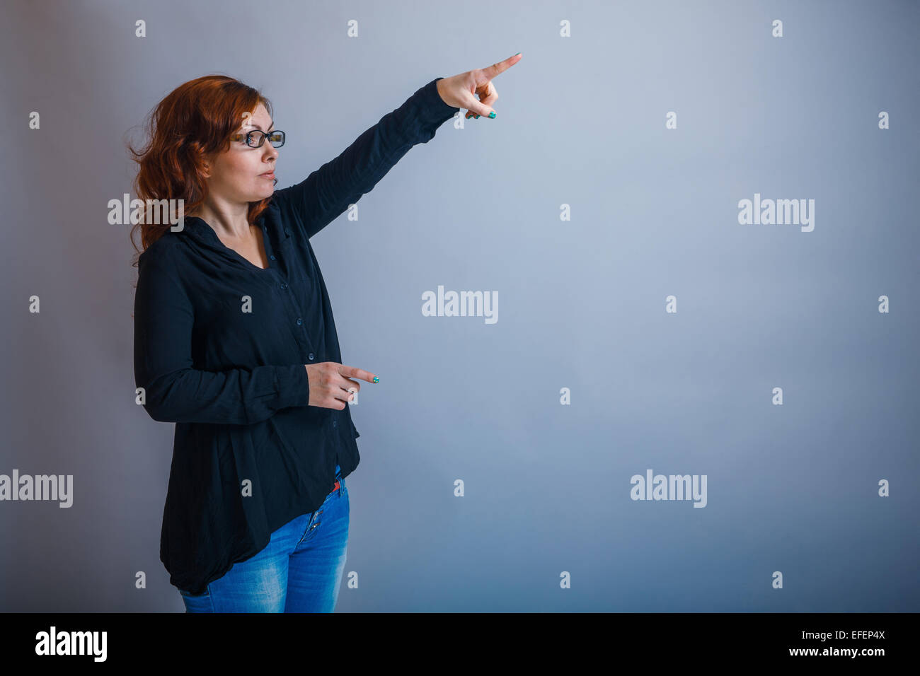 European -looking woman of 30 years is pointing in the dire Stock Photo ...