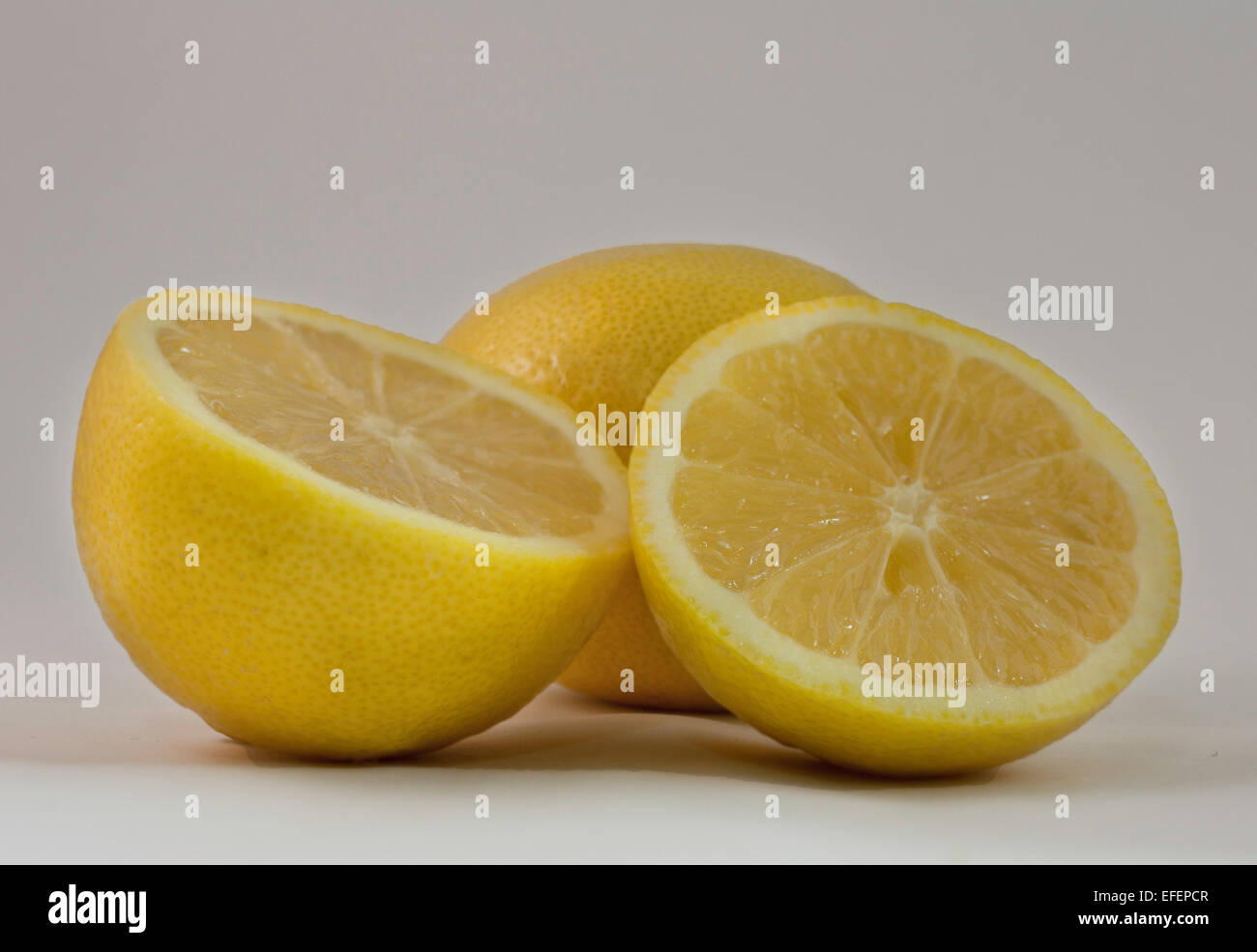 lemon slices and one whole lemon Stock Photo - Alamy