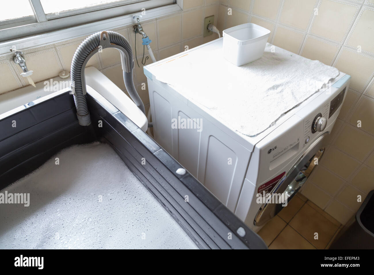 Sao Paulo, Brazil. 2nd February, 2015. A family collects the washing ...