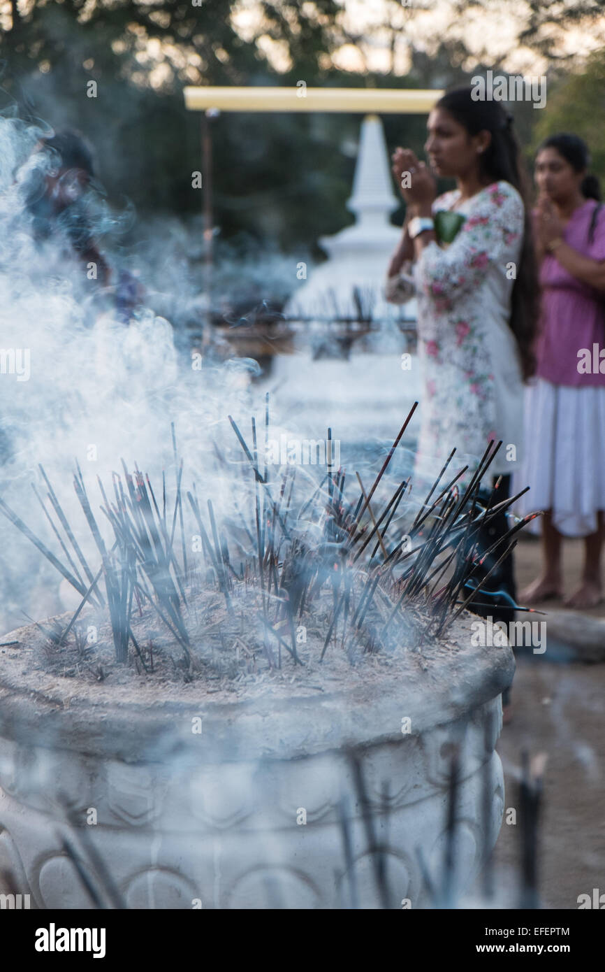 Incense offering by pilgrims devotees at Temple of the Sacred Tooth ...