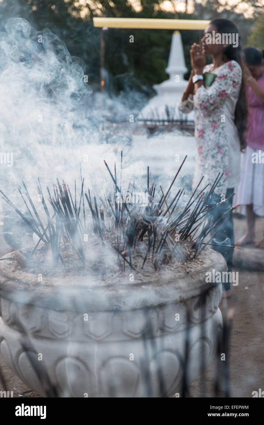 Incense offering by pilgrims devotees at Temple of the Sacred Tooth ...