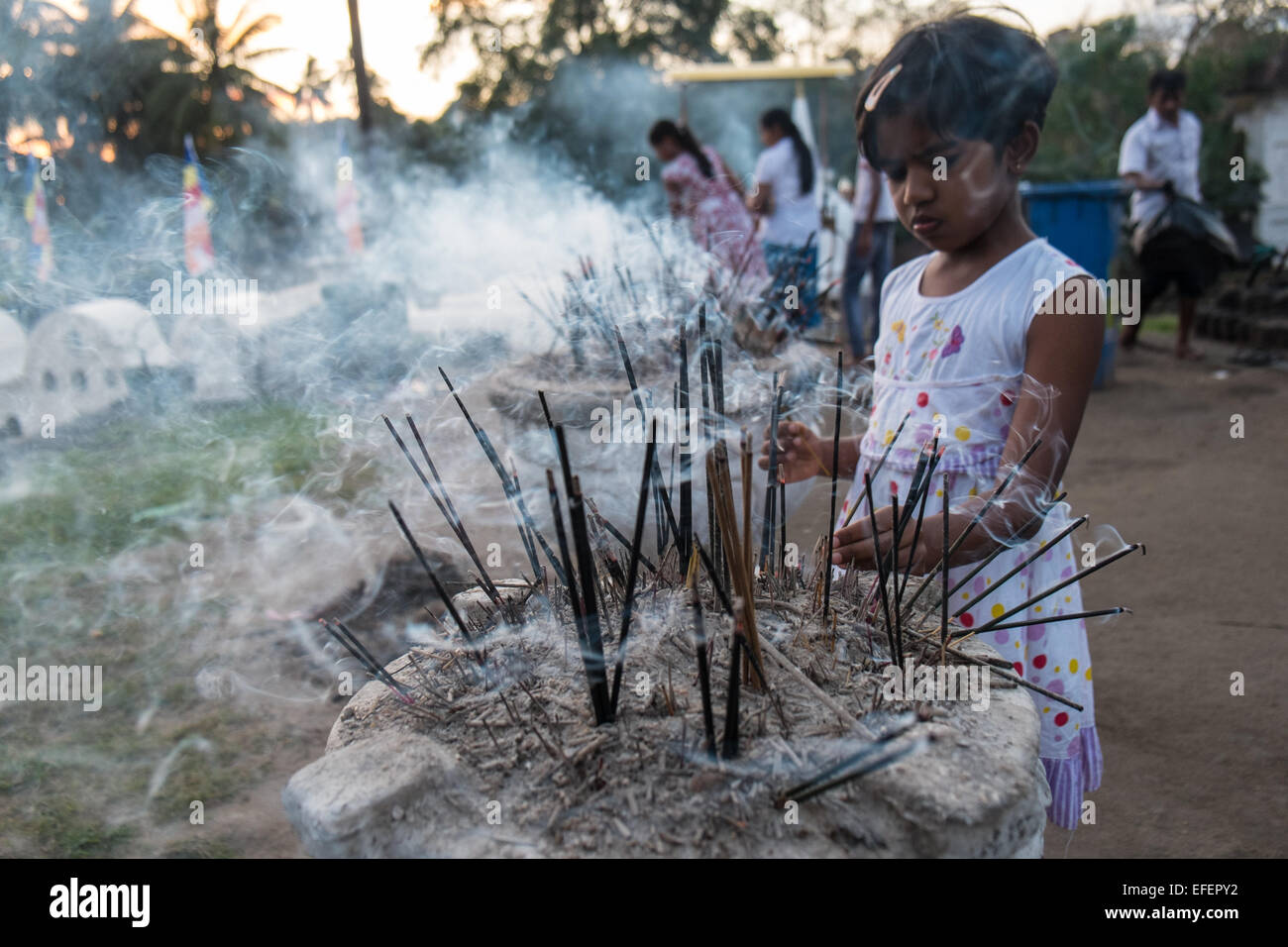 Incense offering by pilgrims devotees at Temple of the Sacred Tooth ...