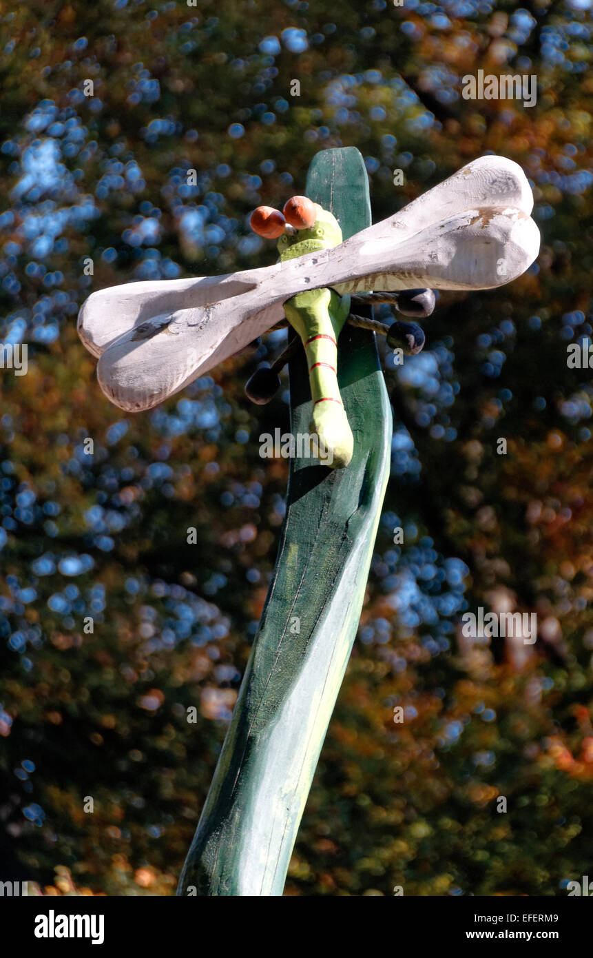 Wooden insect on top of a totem pole as decoration for a children's ...