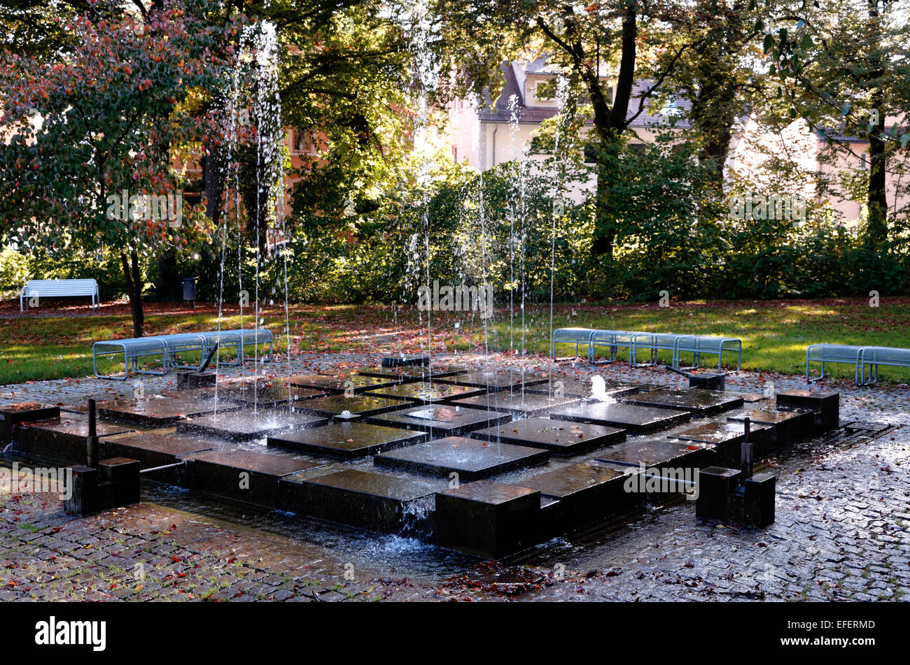 Fountain over rectangular blocks, Children's playground, Arlen, Germany ...