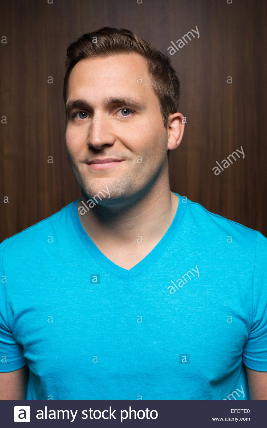 Man smiling blue shirt hi-res stock photography and images - Alamy