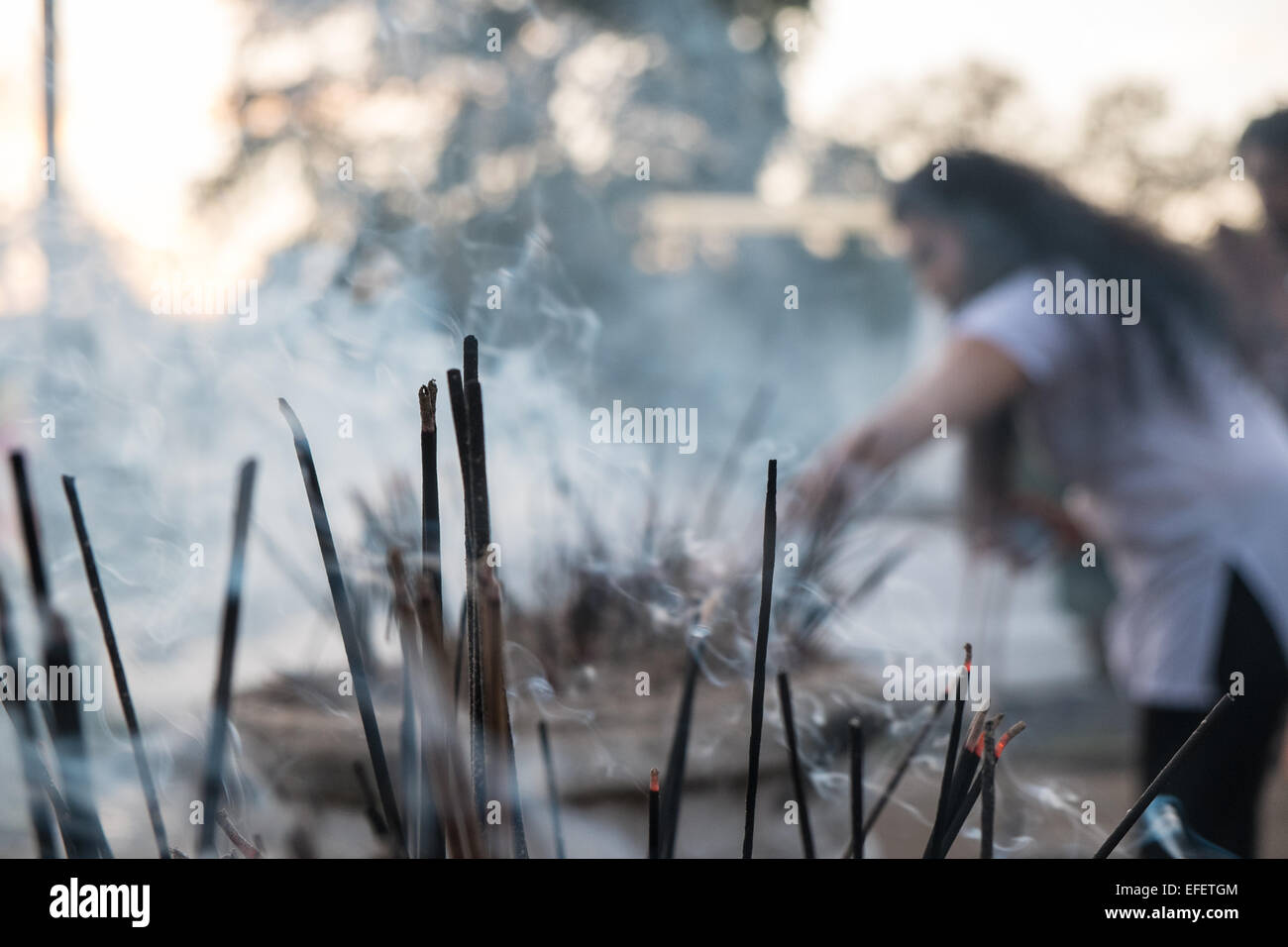 Incense offering by pilgrims devotees at Temple of the Sacred Tooth ...
