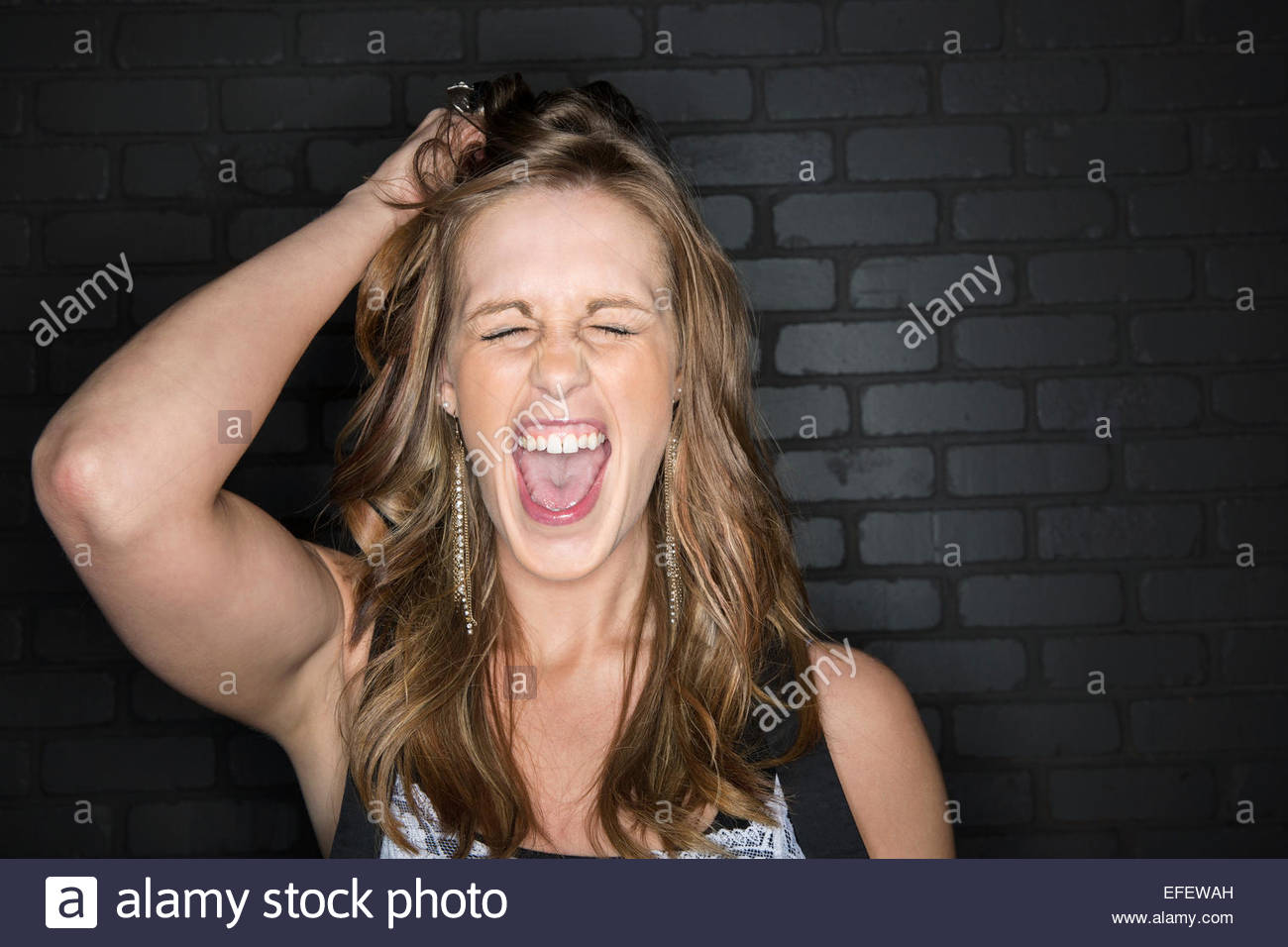 Hands in hair hi-res stock photography and images - Alamy