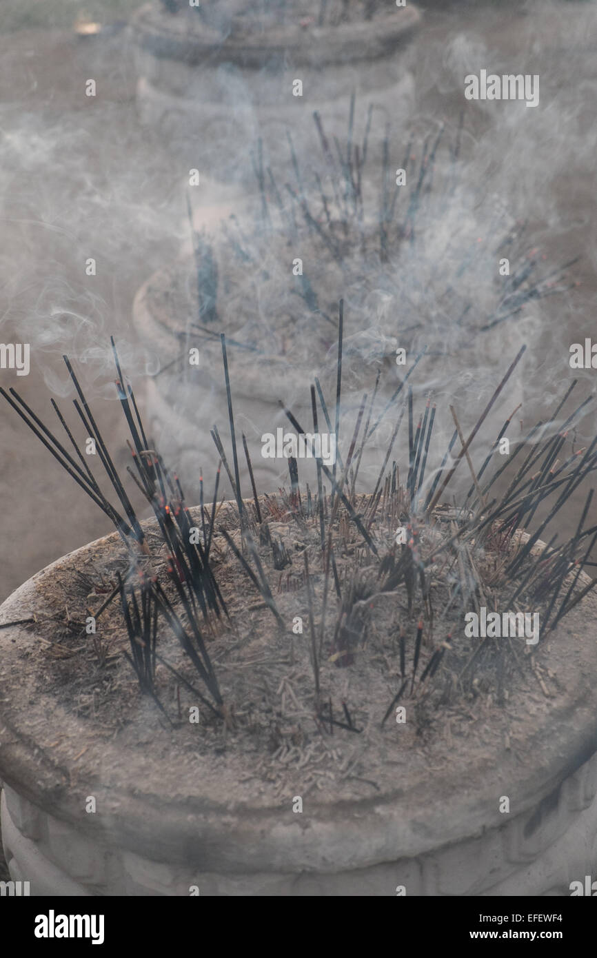 Incense offering by pilgrims devotees at Temple of the Sacred Tooth ...