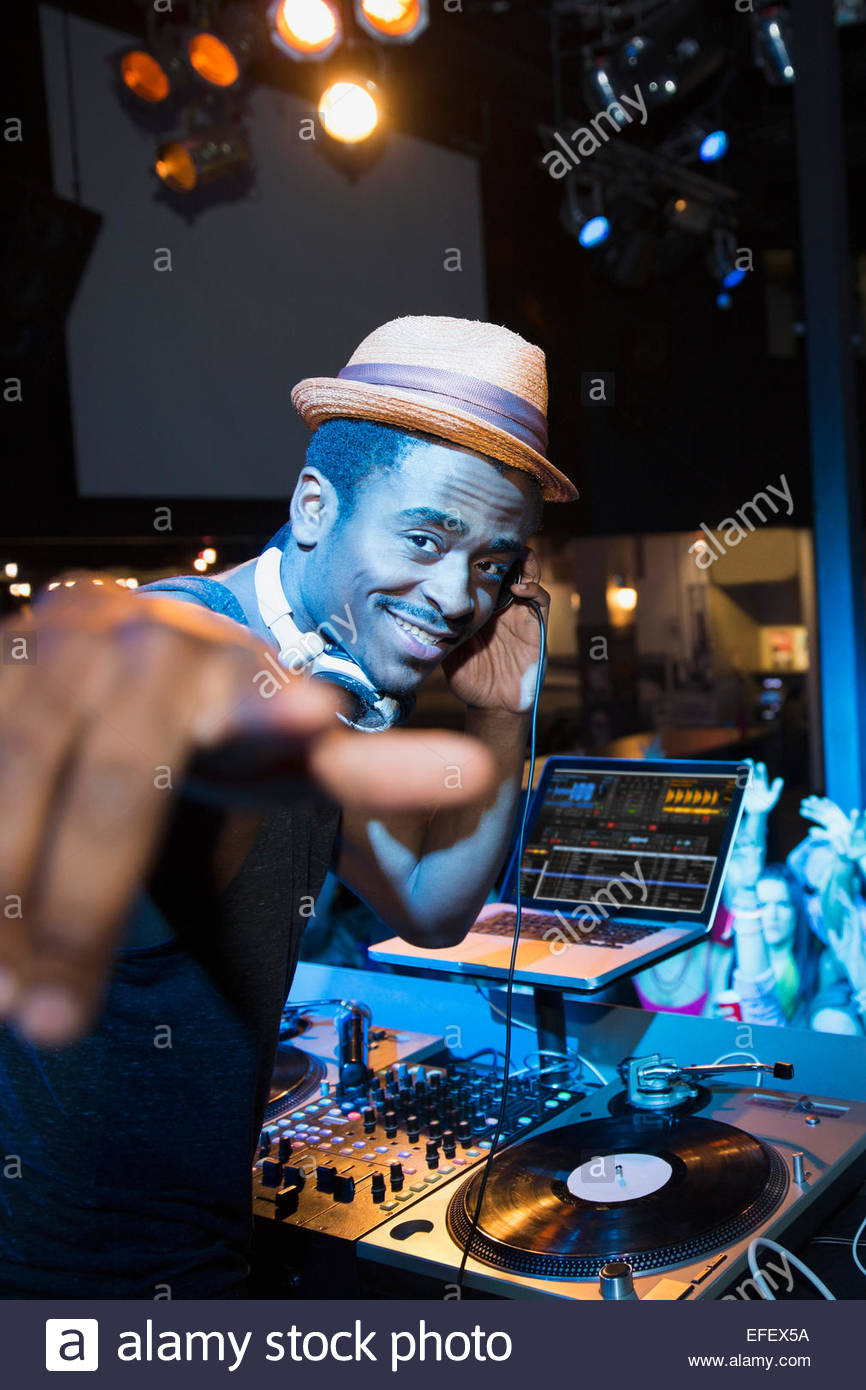 Portrait of confident DJ at turntable in nightclub Stock Photo - Alamy