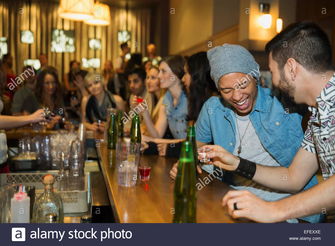 Woman drinking alcohol bar shots hi-res stock photography and images ...