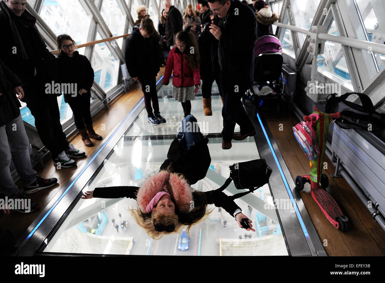 Visitors on the new glass floor in Tower Bridge. One of the bridge’s ...