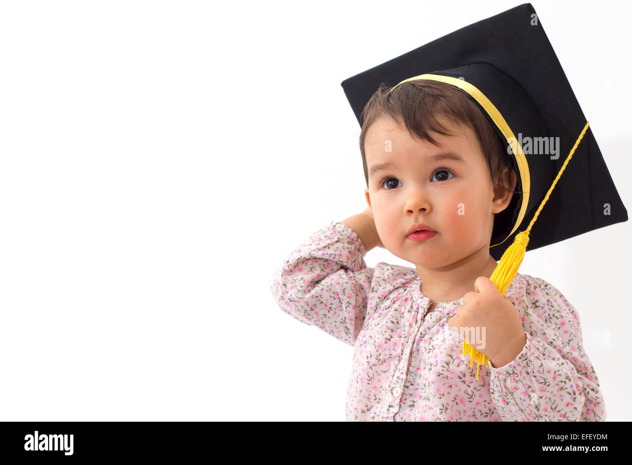 Little girl with graduation hat isolated on white background Stock ...