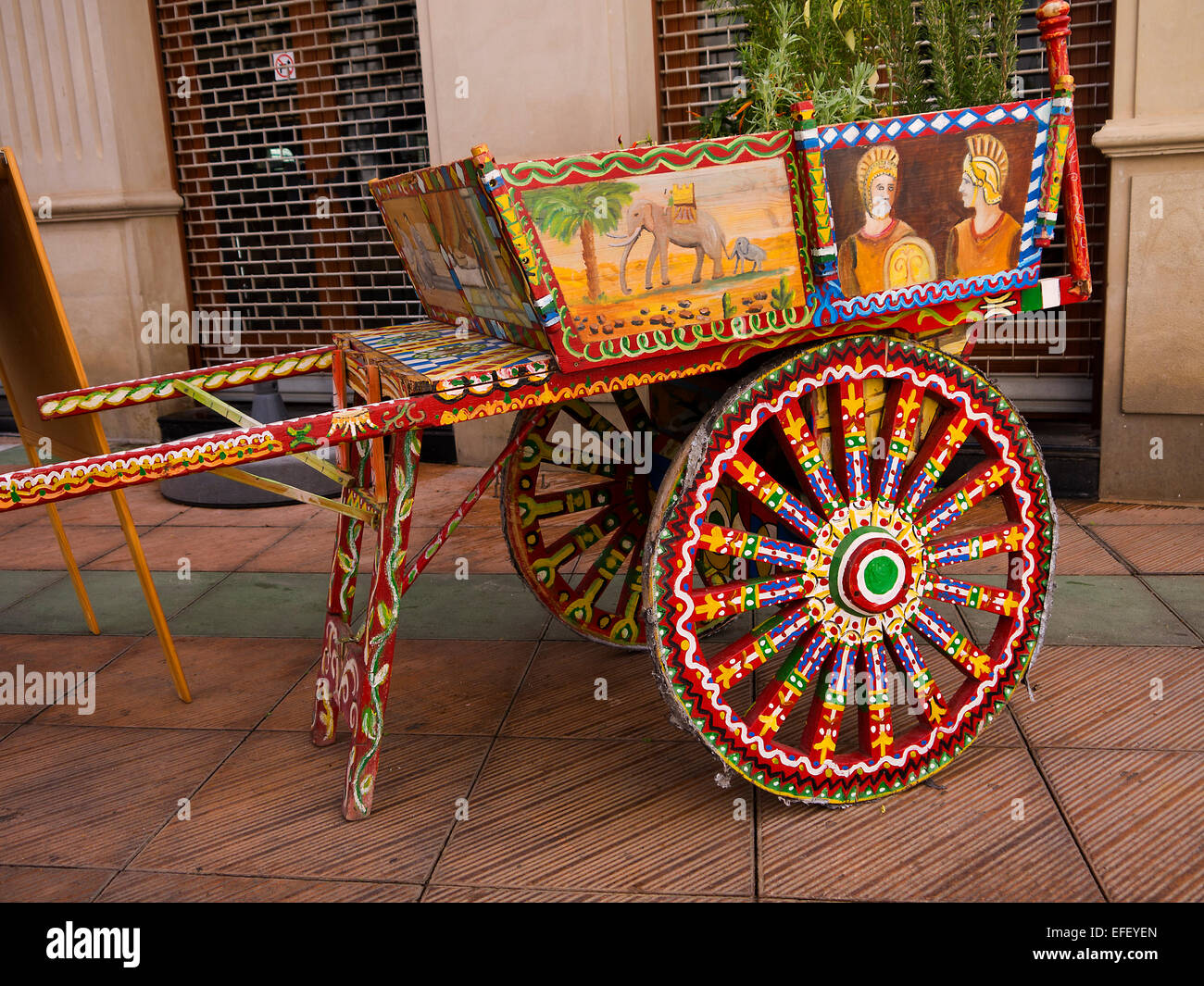 Traditionally decorated Sicilian Carts outside a pizzeria in Nerja ...