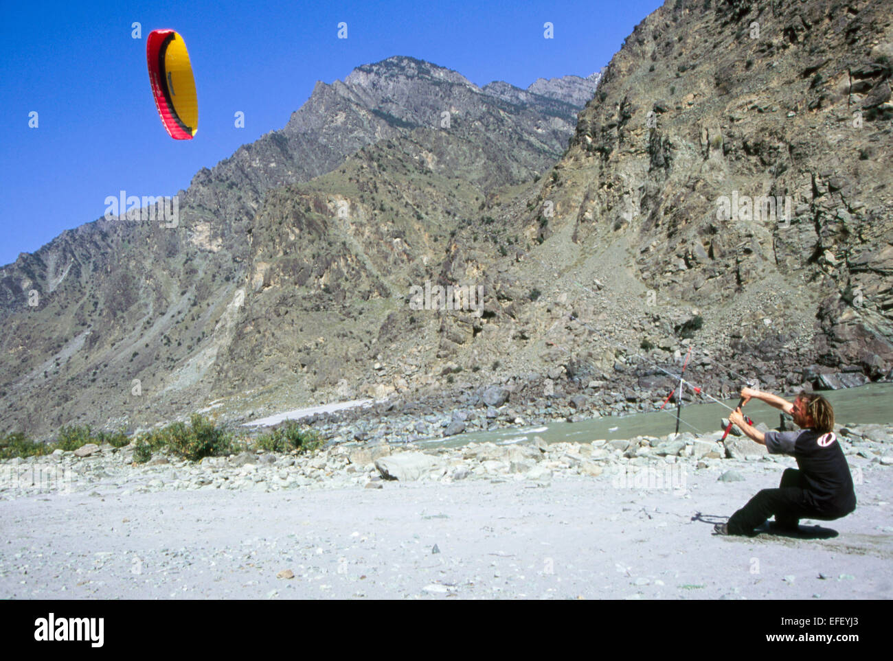 Power kite flyer flying kite in Pakistan, along KKH Stock Photo - Alamy