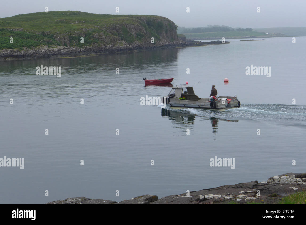 The small passenger ferry heading to Mull from Ulva across the Sound of ...