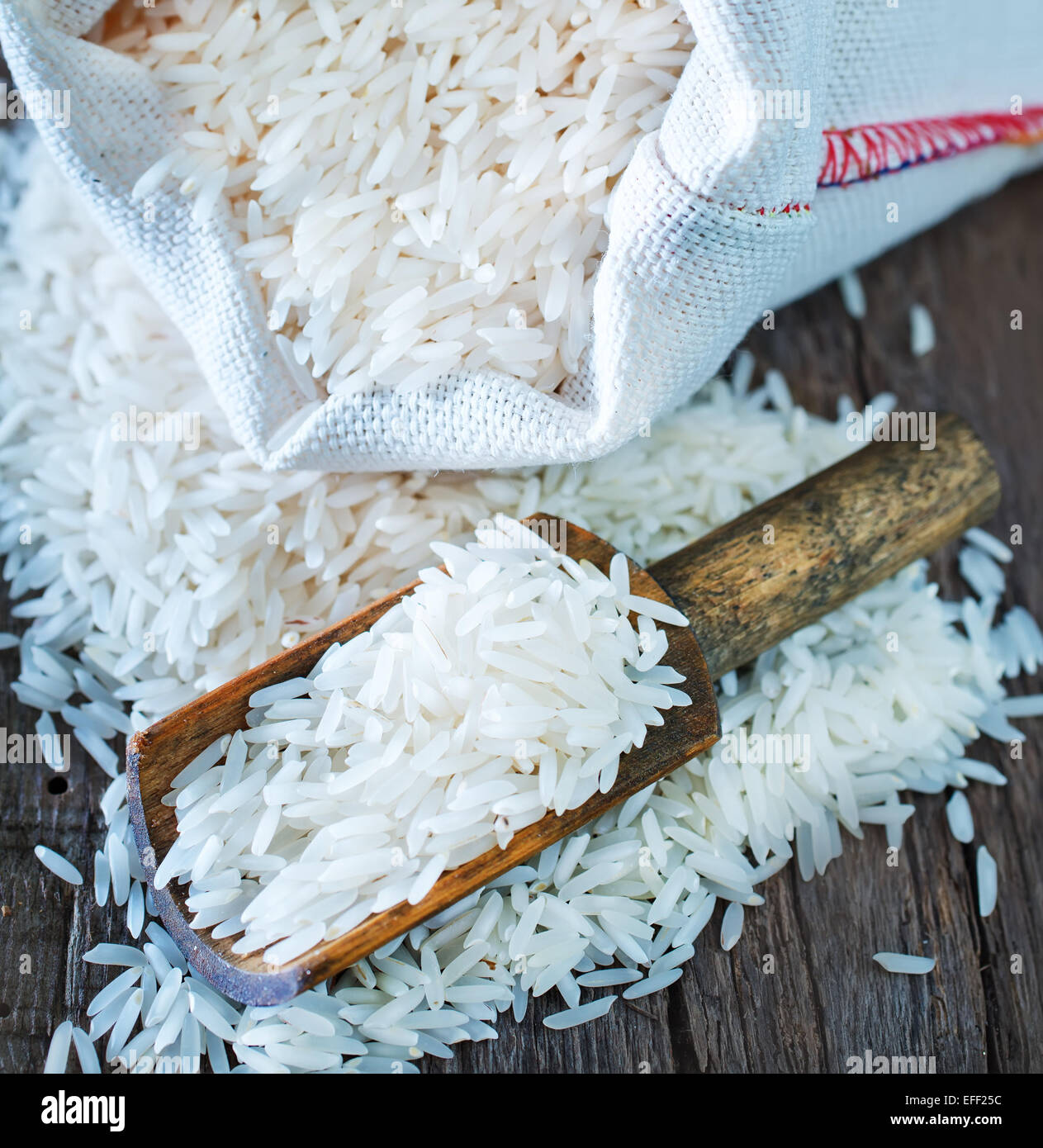 raw rice in bag and on a table Stock Photo - Alamy