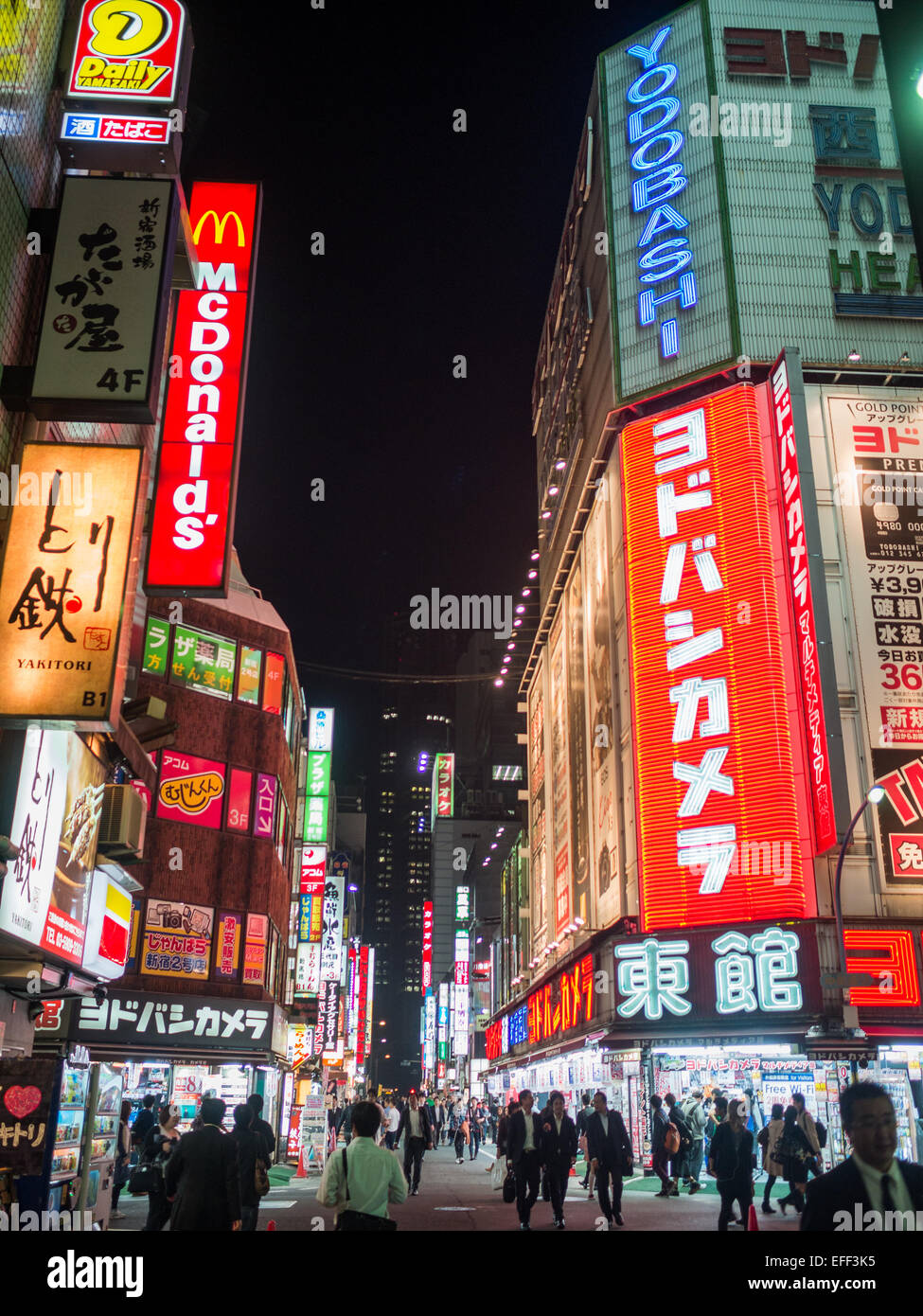 Neon sights lit at night in Shinjuku street Stock Photo - Alamy