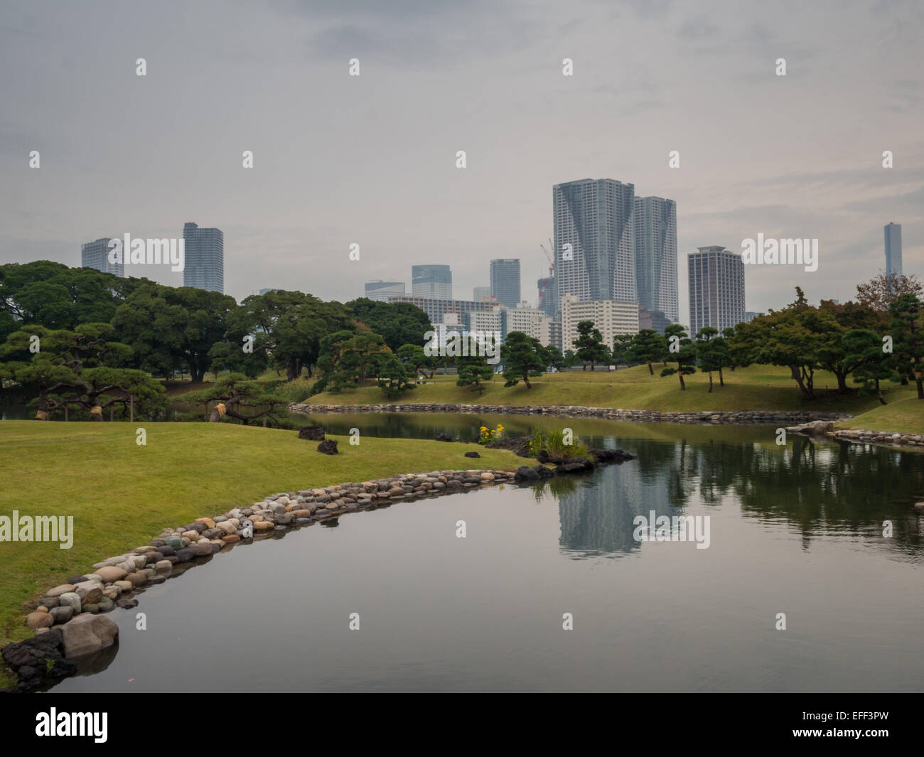 Japanese garden landscape of Hama Rikyu Onshi-teien reflected in the ...
