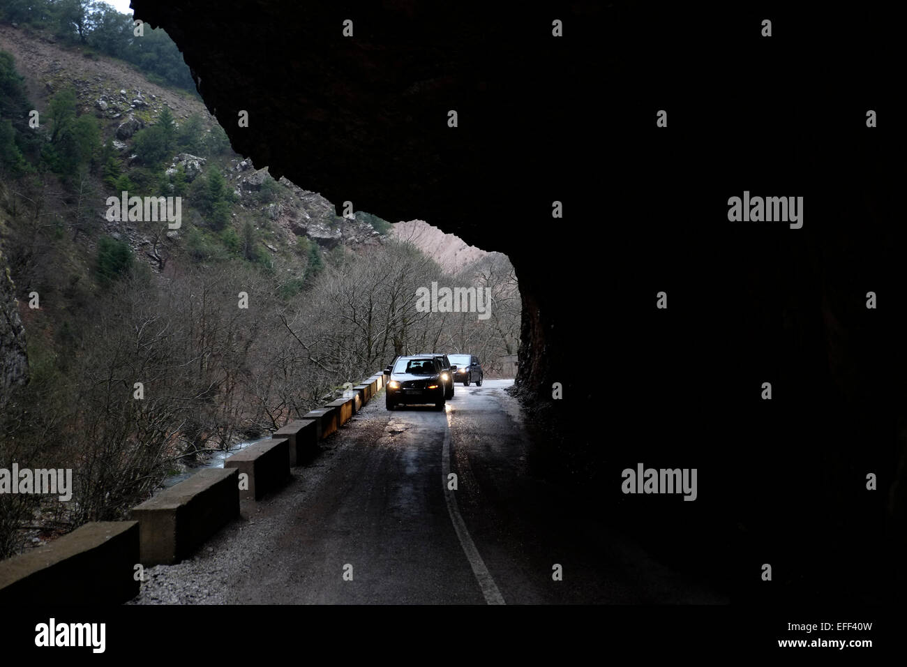 A narrow windy road under rocky mountains from Karpenisi to Prousos in ...