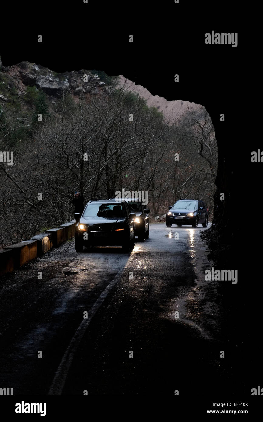 A narrow windy road under rocky mountains from Karpenisi to Prousos in ...