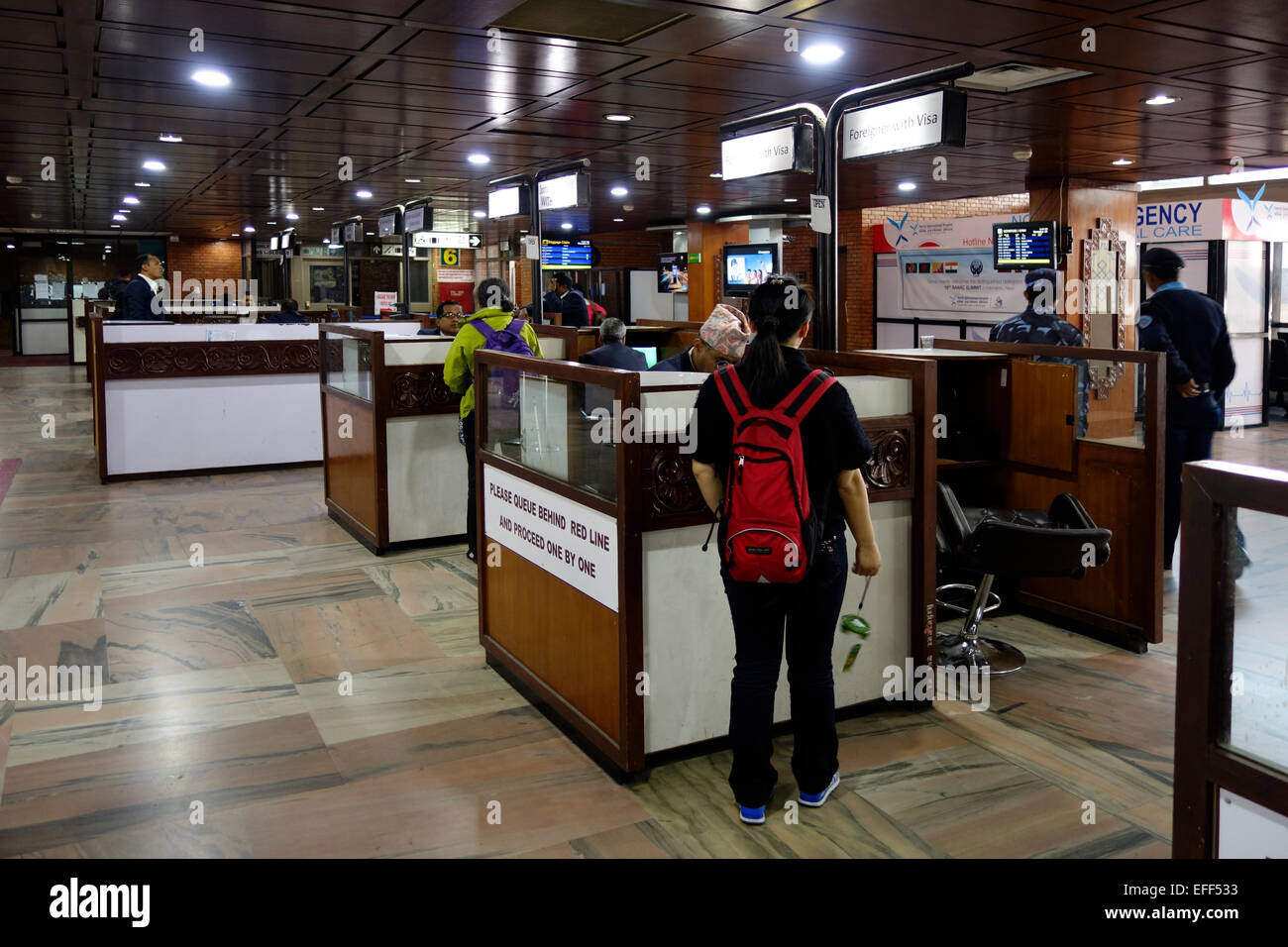 Passengers pass through passport control counters in Tribhuvan ...