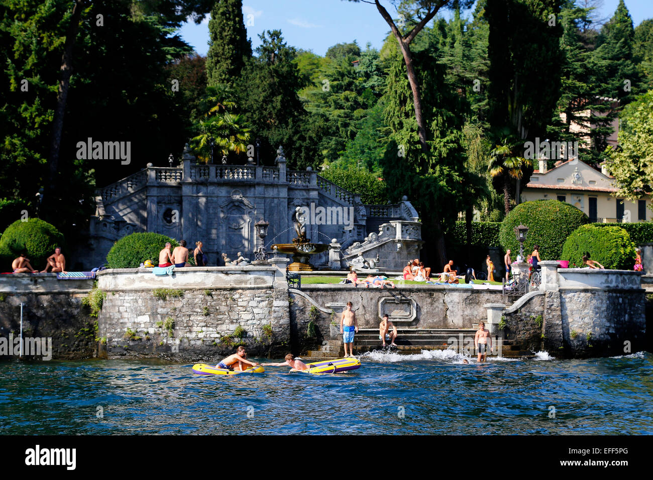 Summer in Lake Como - Hotel Guests swimming on the Lake Stock Photo - Alamy