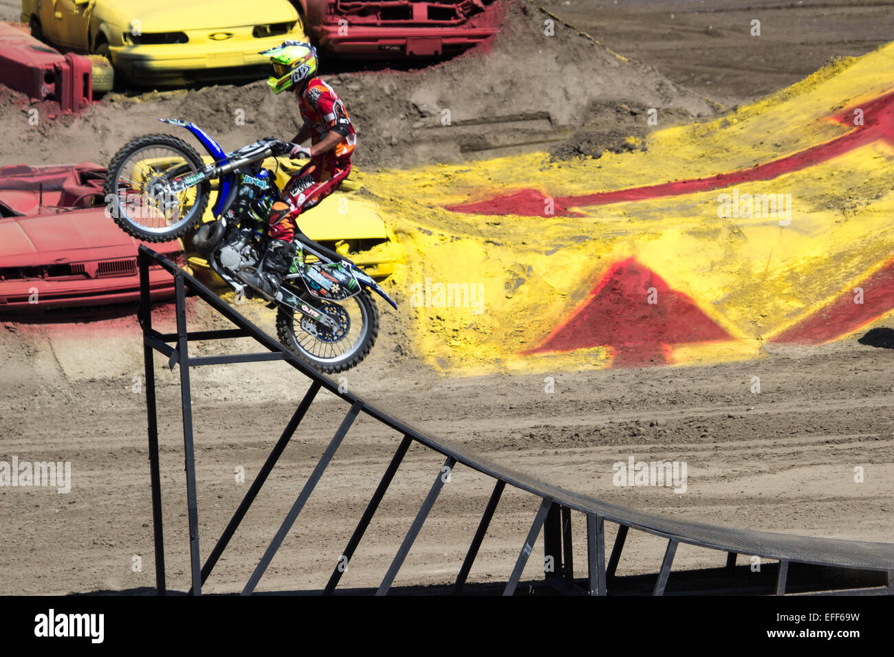 Ramp Up- A motorcross biker moments before his mid-air stunt at the ...