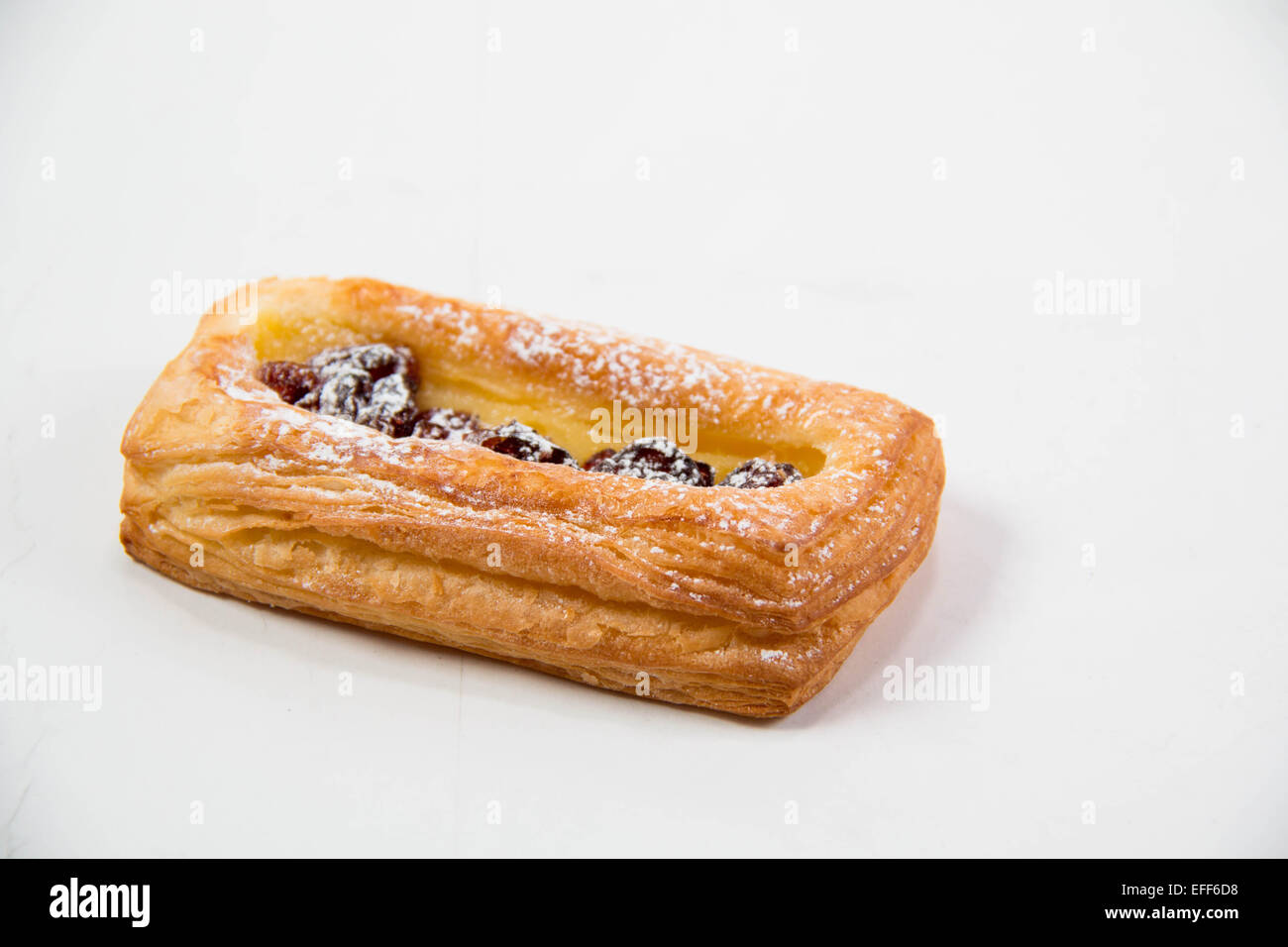 A Raisin Danish tasty pastronbn white background Stock Photo - Alamy