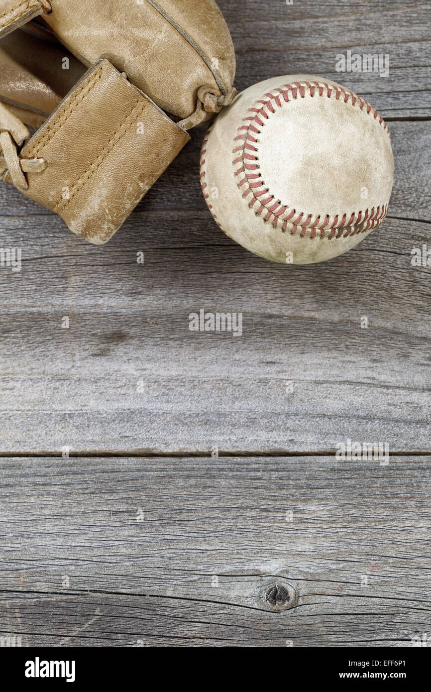 Vertical top view angle of old baseball and weathered leather mitt on ...
