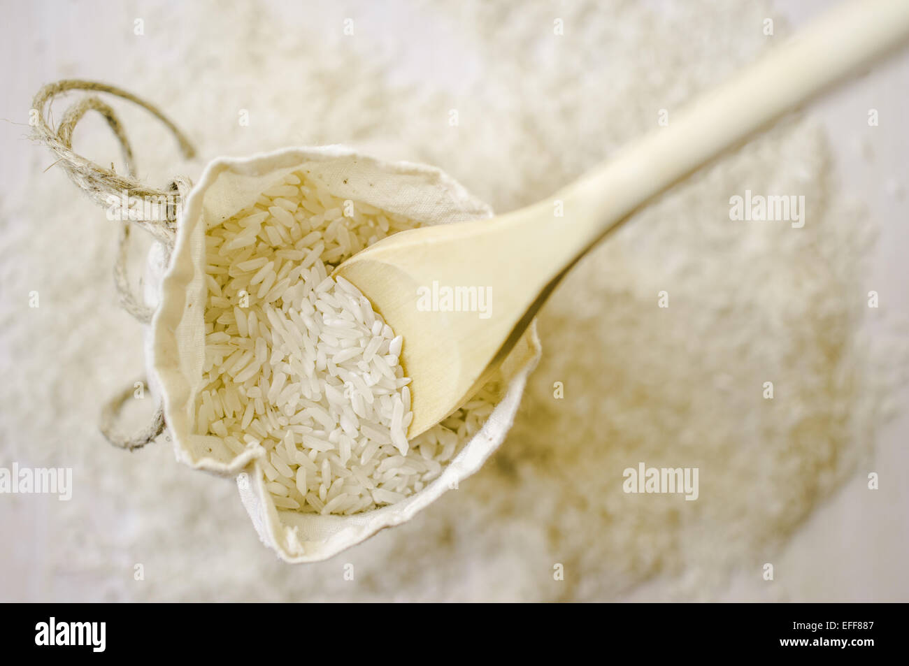 Long grain rice in bulk sack with a shovel Stock Photo - Alamy
